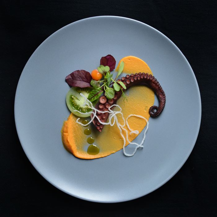 Octopus, carrot puree and ginger, tomato, herbs, sesame oil. | Photo by ...